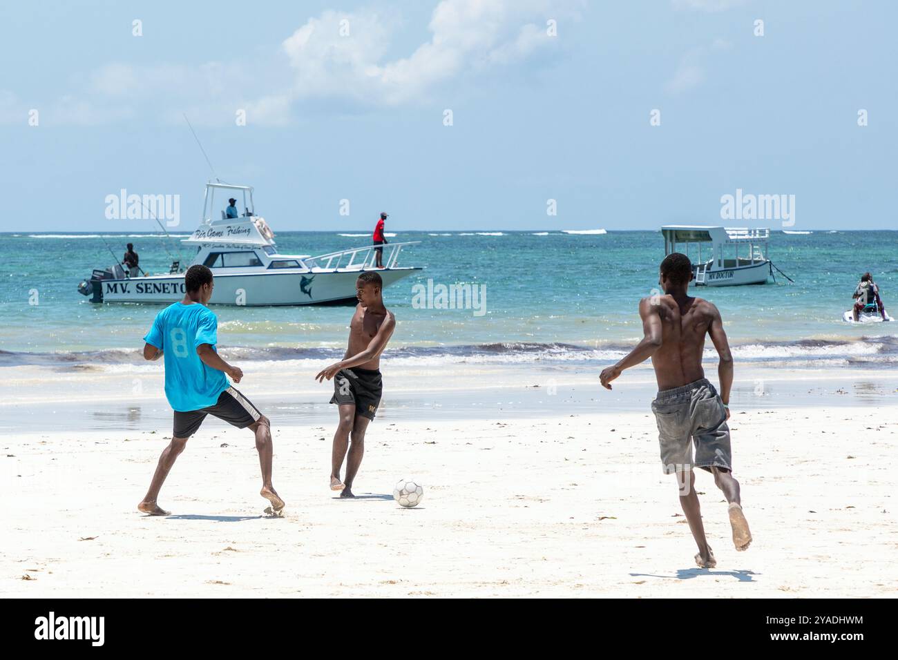 Local boys playing football on Diani Beach, Indian Ocean, Galu district ...