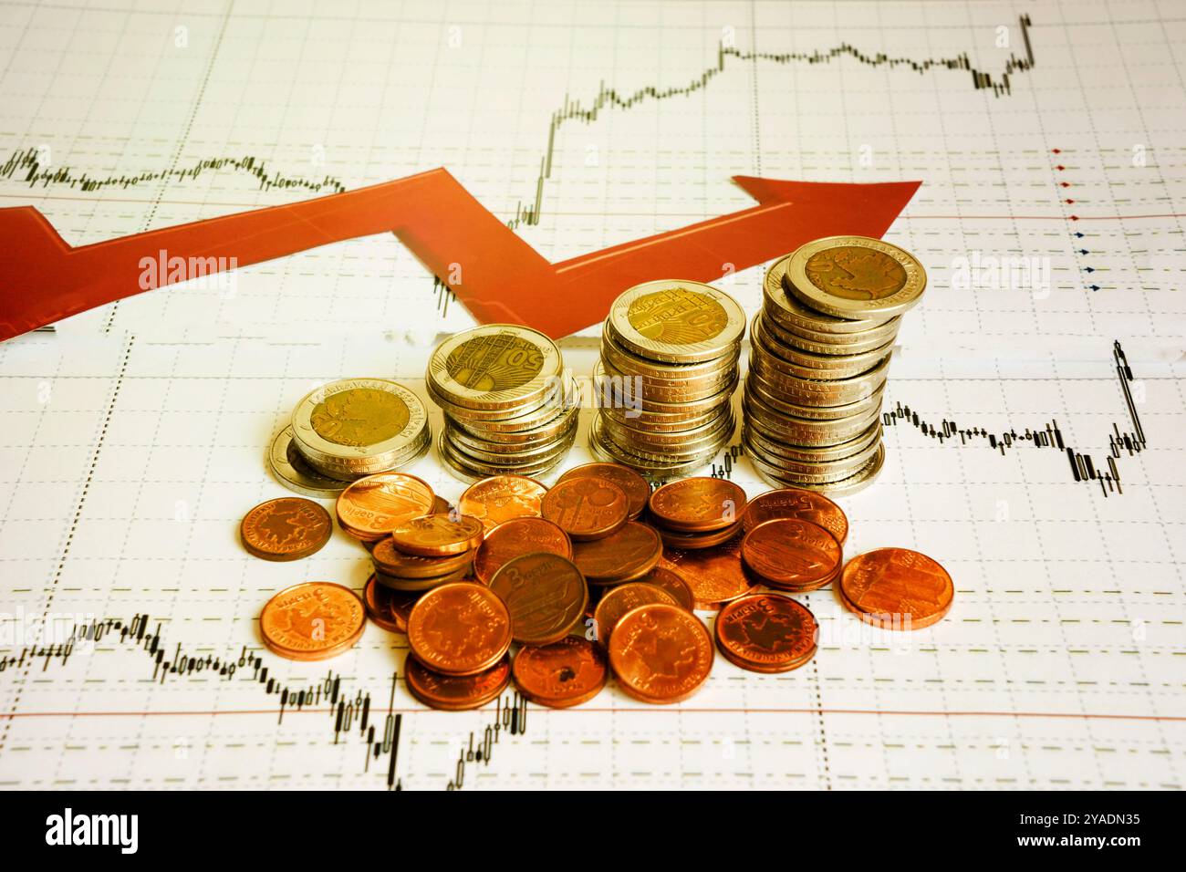 Business diagram on financial report with coins Stock Photo - Alamy