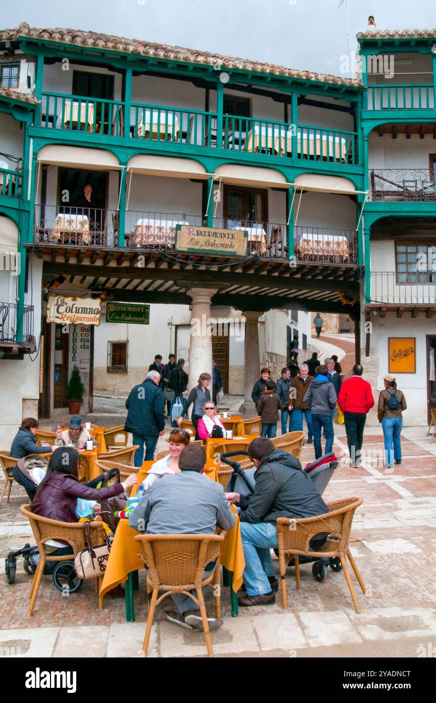 People sitting in a terrace. Plaza Mayor, Chinchon, Madrid province ...