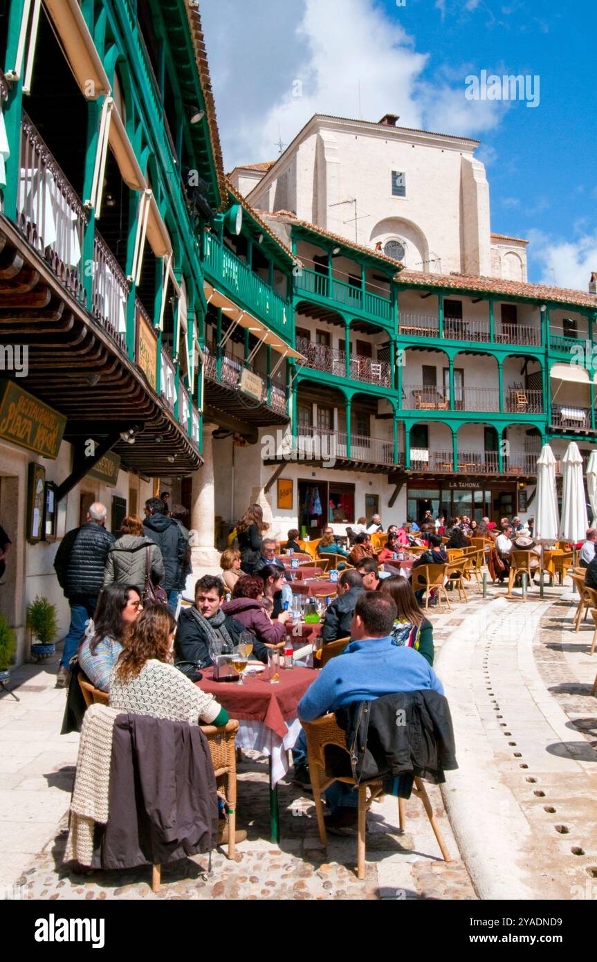 People sitting in a terrace. Plaza Mayor, Chinchon, Madrid province ...