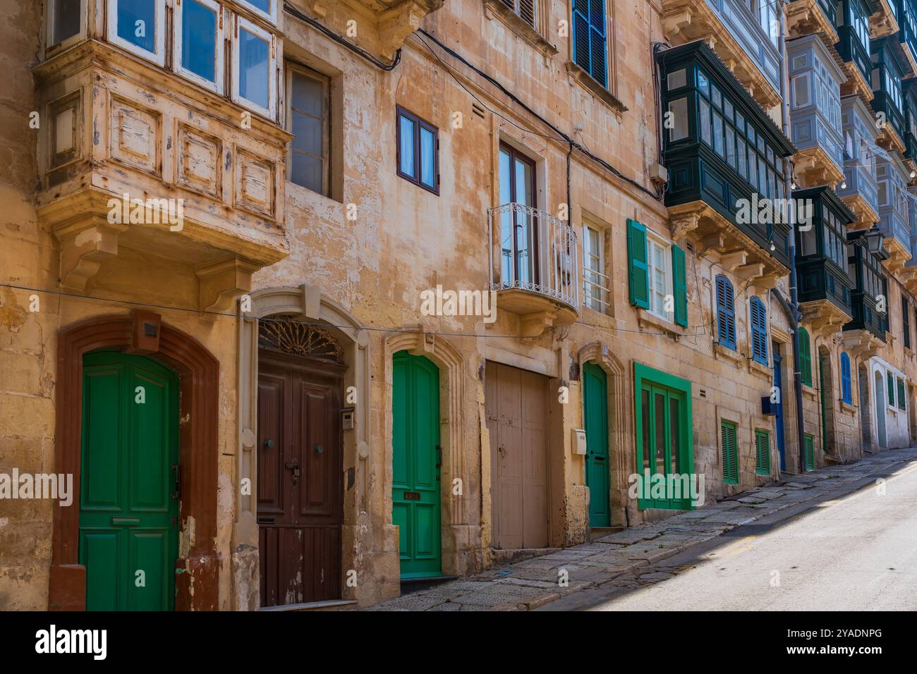 Traditional Maltese buildings with colourful balconies in historic old ...