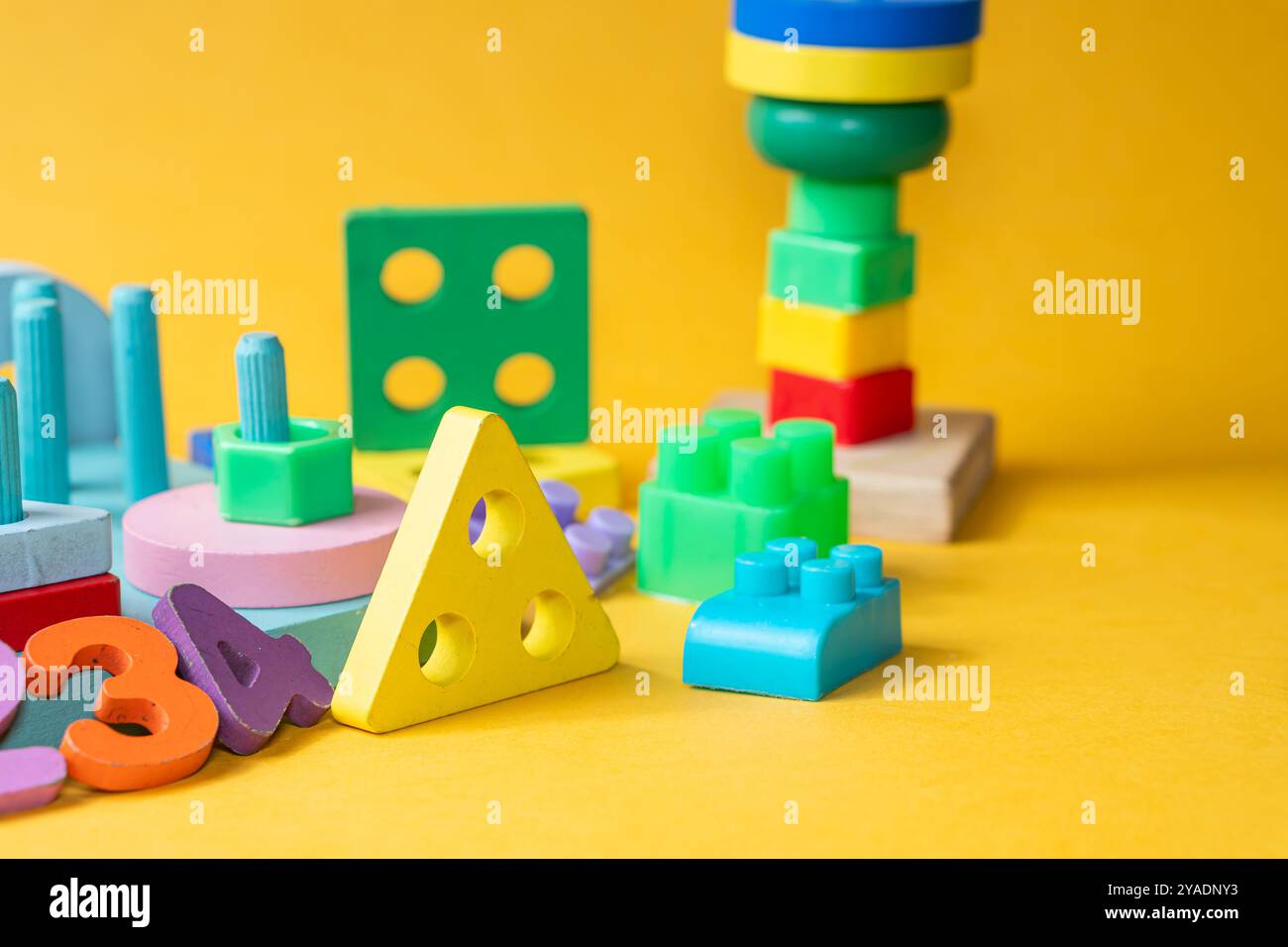 A colorful arrangement of various children educational toys on a bright ...