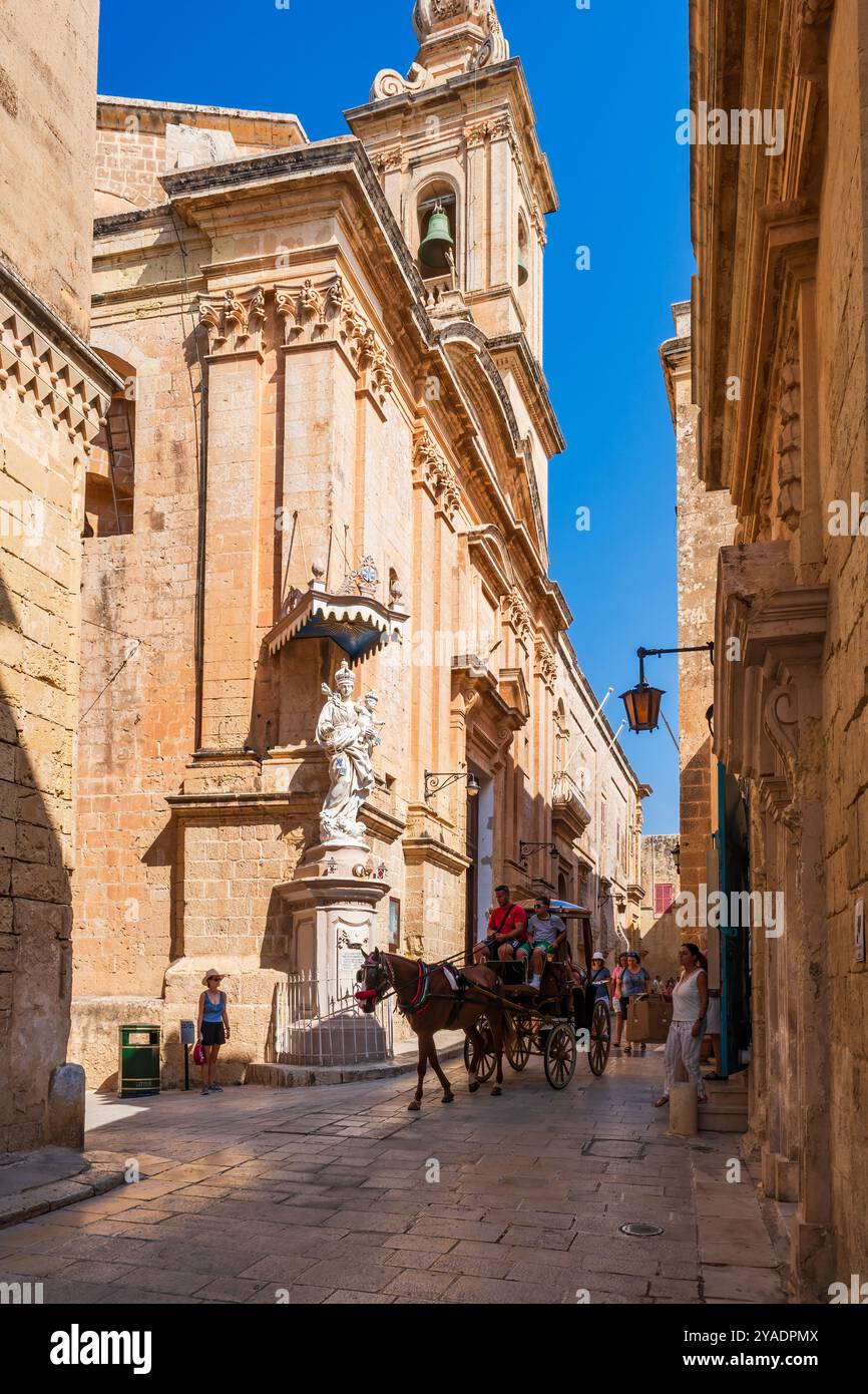 MDINA, MALTA - SEPTEMBER 02, 2024: Visitors explore Mdina in a horse ...