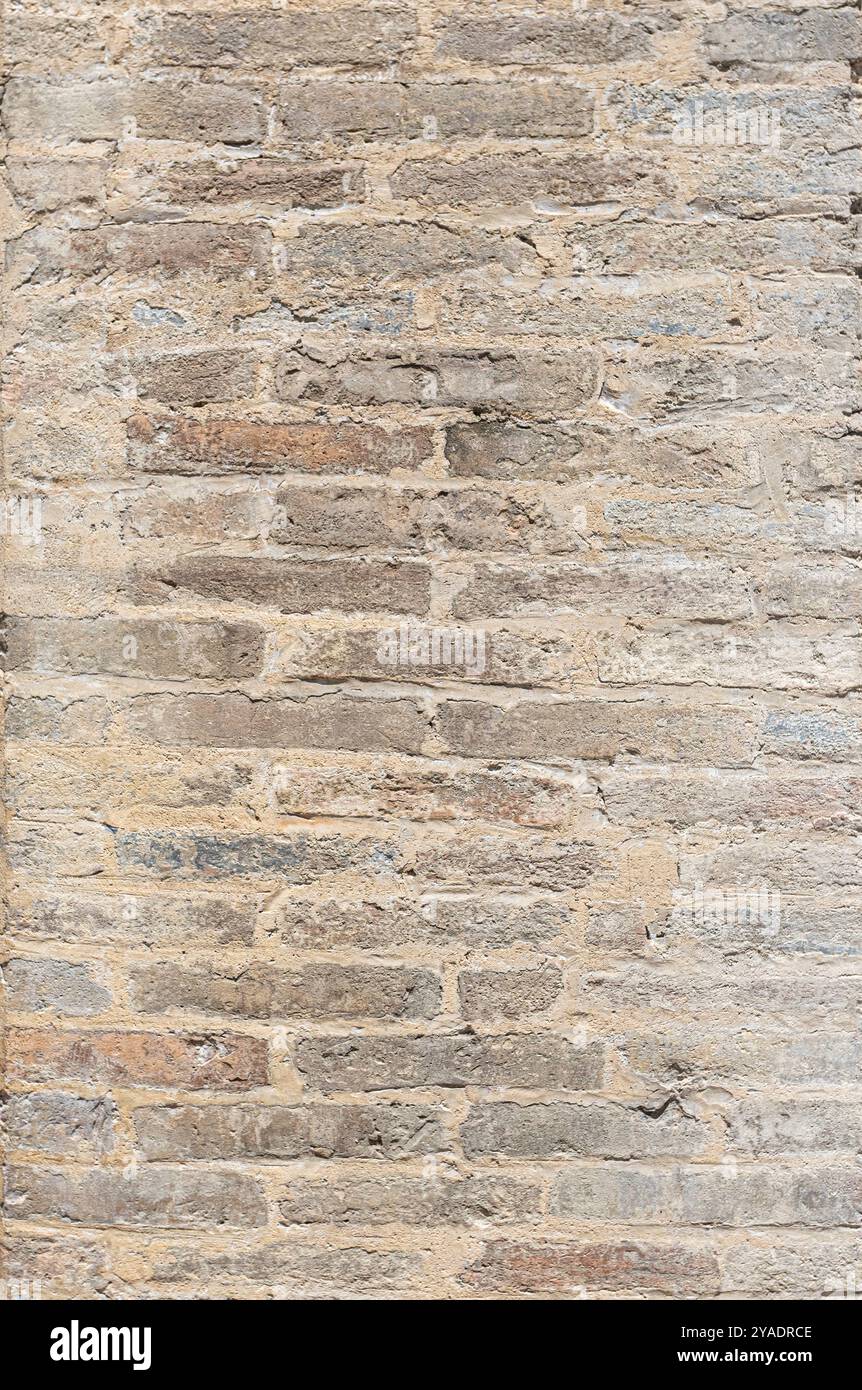Brick wall of beige stone background Stock Photo - Alamy