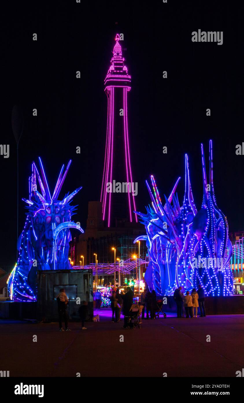 People around the light show on Blackpool promenade, with Blackpool ...