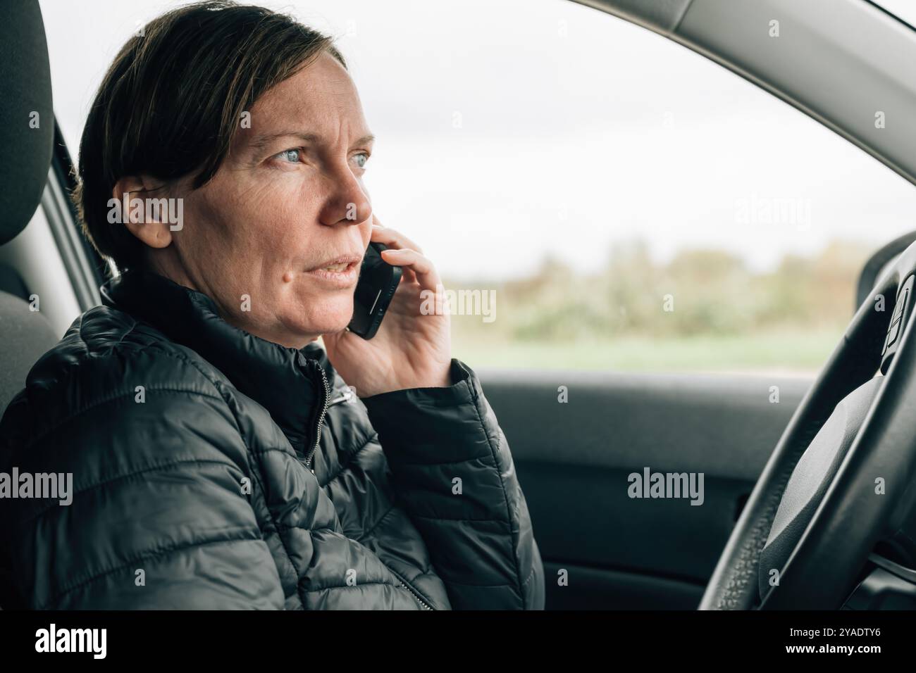 Driver talking on smartphone hi-res stock photography and images - Alamy