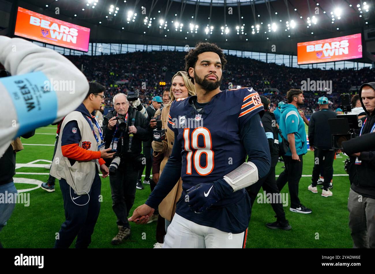 Chicago Bears' Caleb Williams (centre) celebrate on the pitch after the ...