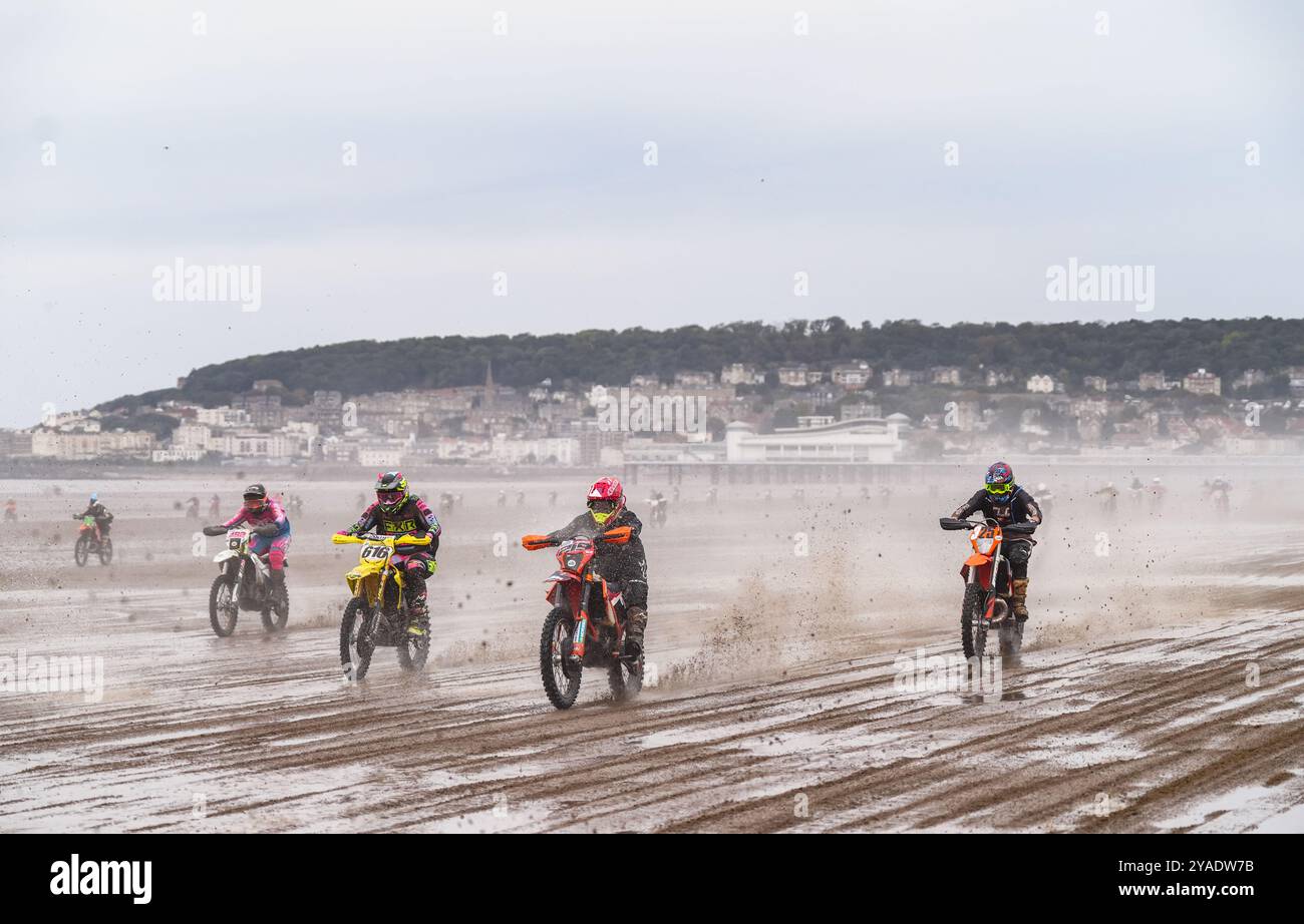 Bikes race along the beach at the start of the ROKiT Weston Beach Race ...