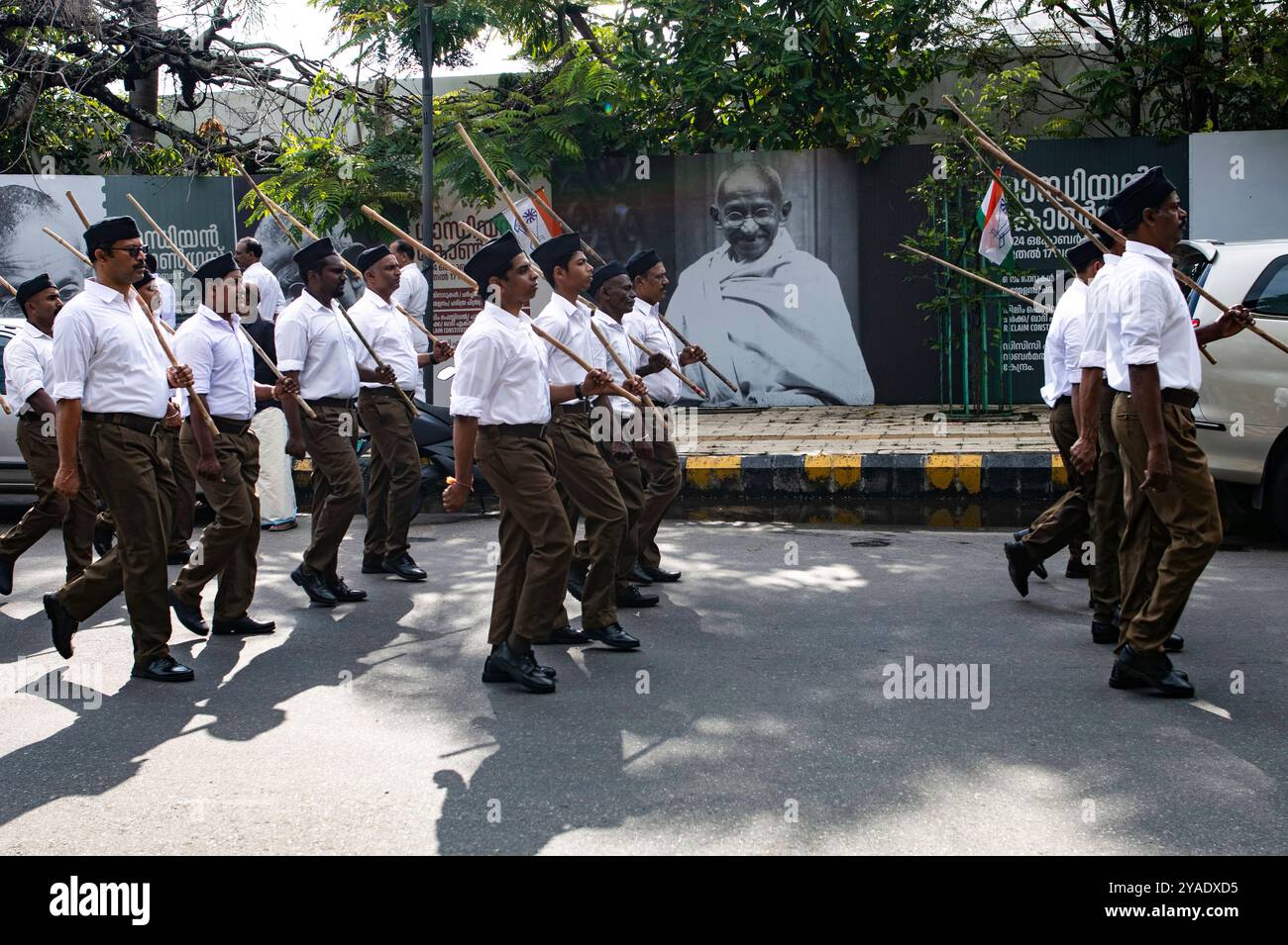 Rashtriya Swayamsevak Sangh volunteers march through a street in Kochi ...