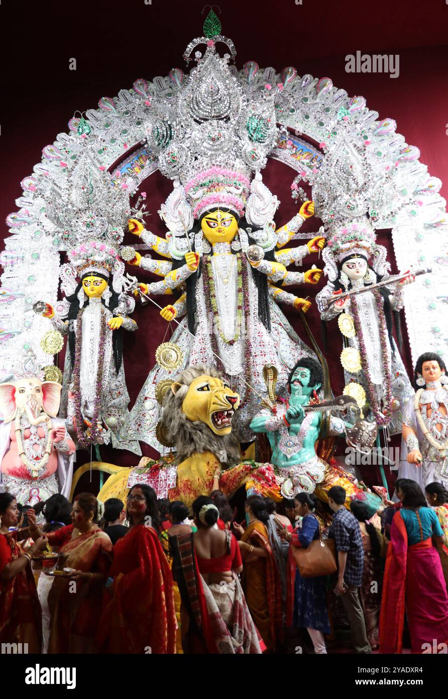 Kolkata, West Bengal, India. 13th Oct, 2024. Hindu women worshipping ...