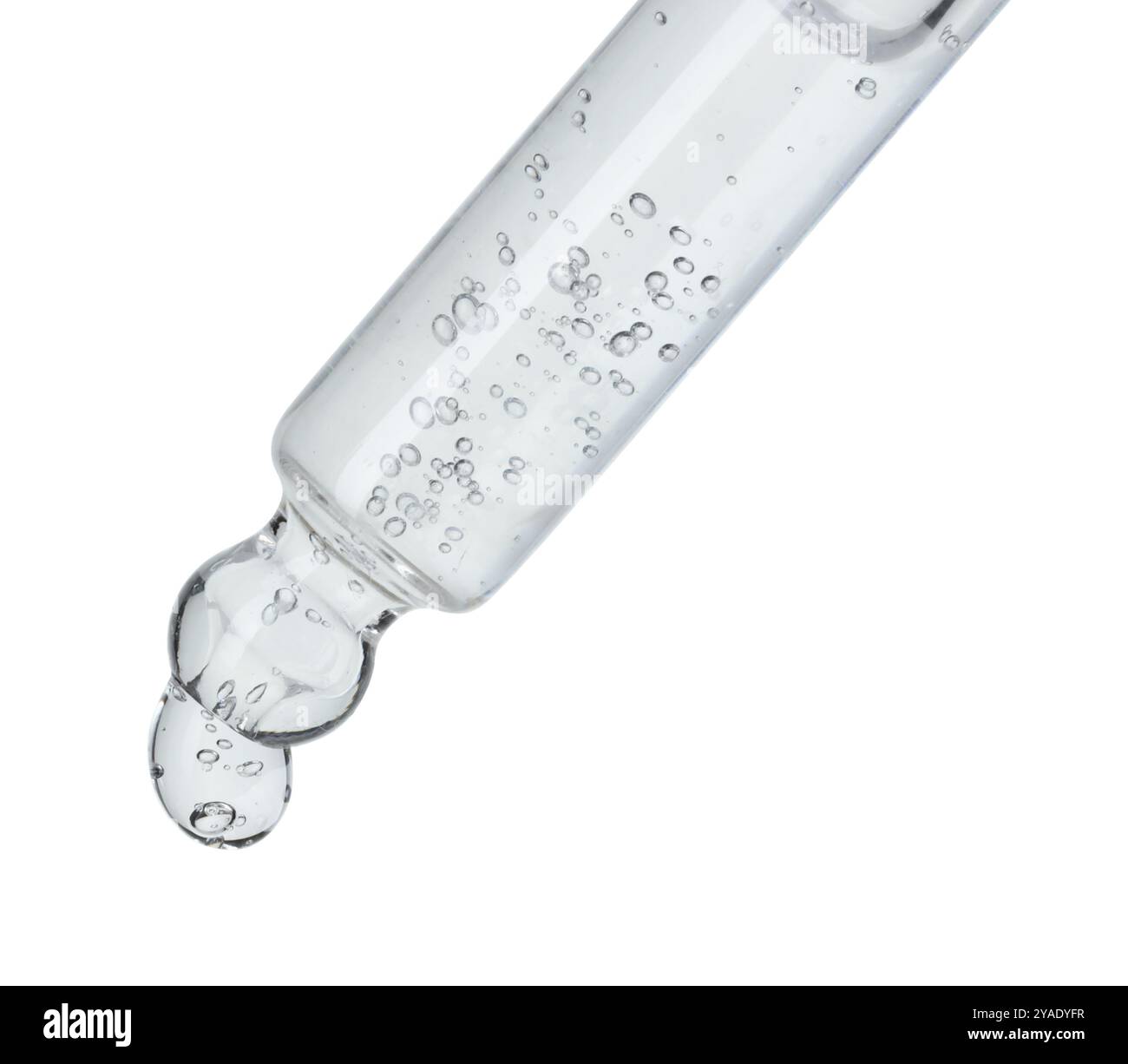Dripping cosmetic serum from pipette on white background Stock Photo ...