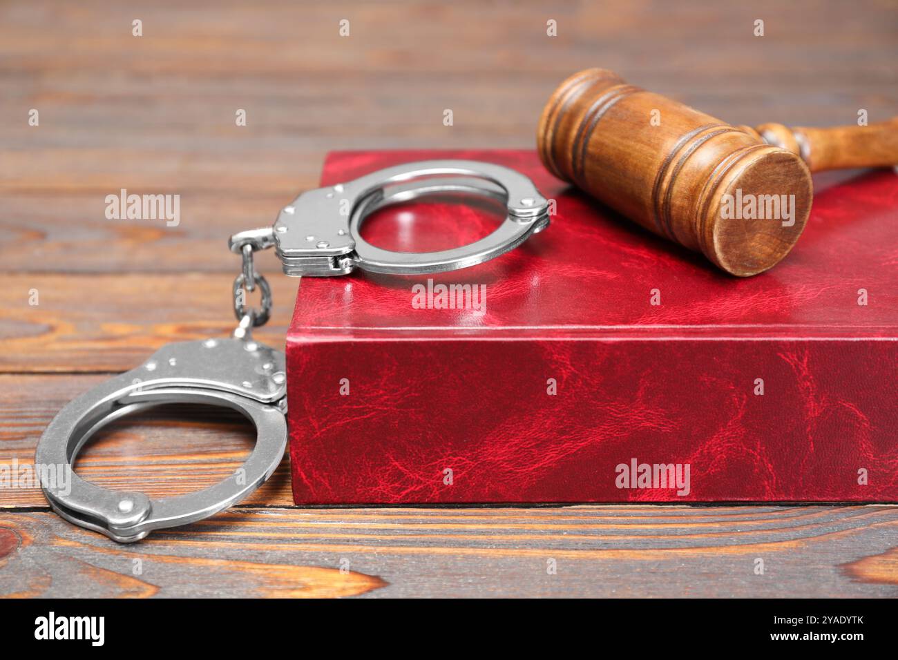 Handcuffs book judges gavel hi-res stock photography and images - Alamy