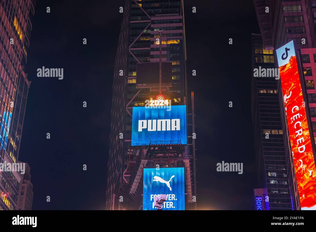 Times Square at night featuring large PUMA advertisements and 2024 ...