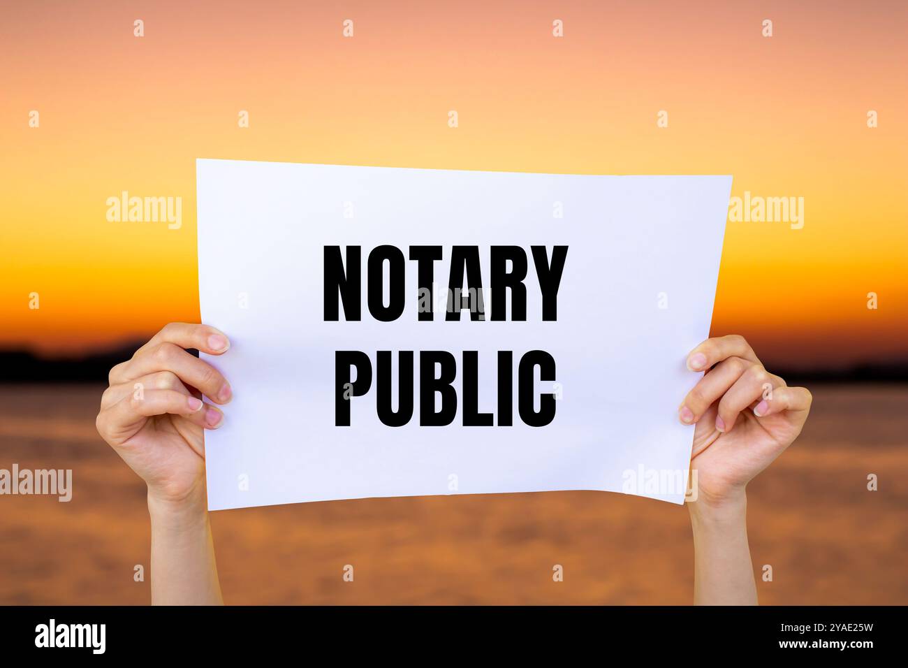 Notary public message written on white paper with blurry lake ...