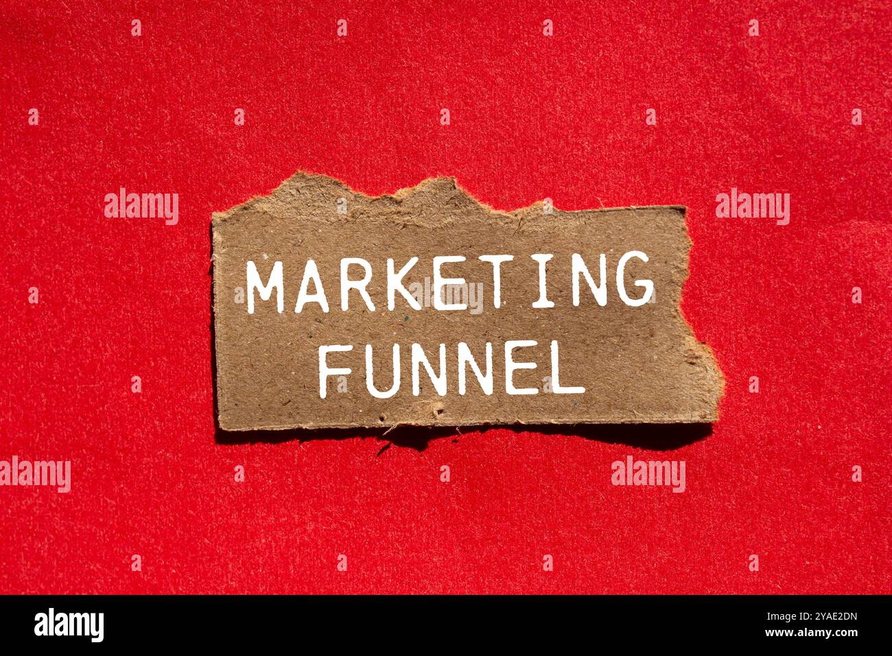 Marketing funnel message written on ripped torn brown paper piece on ...
