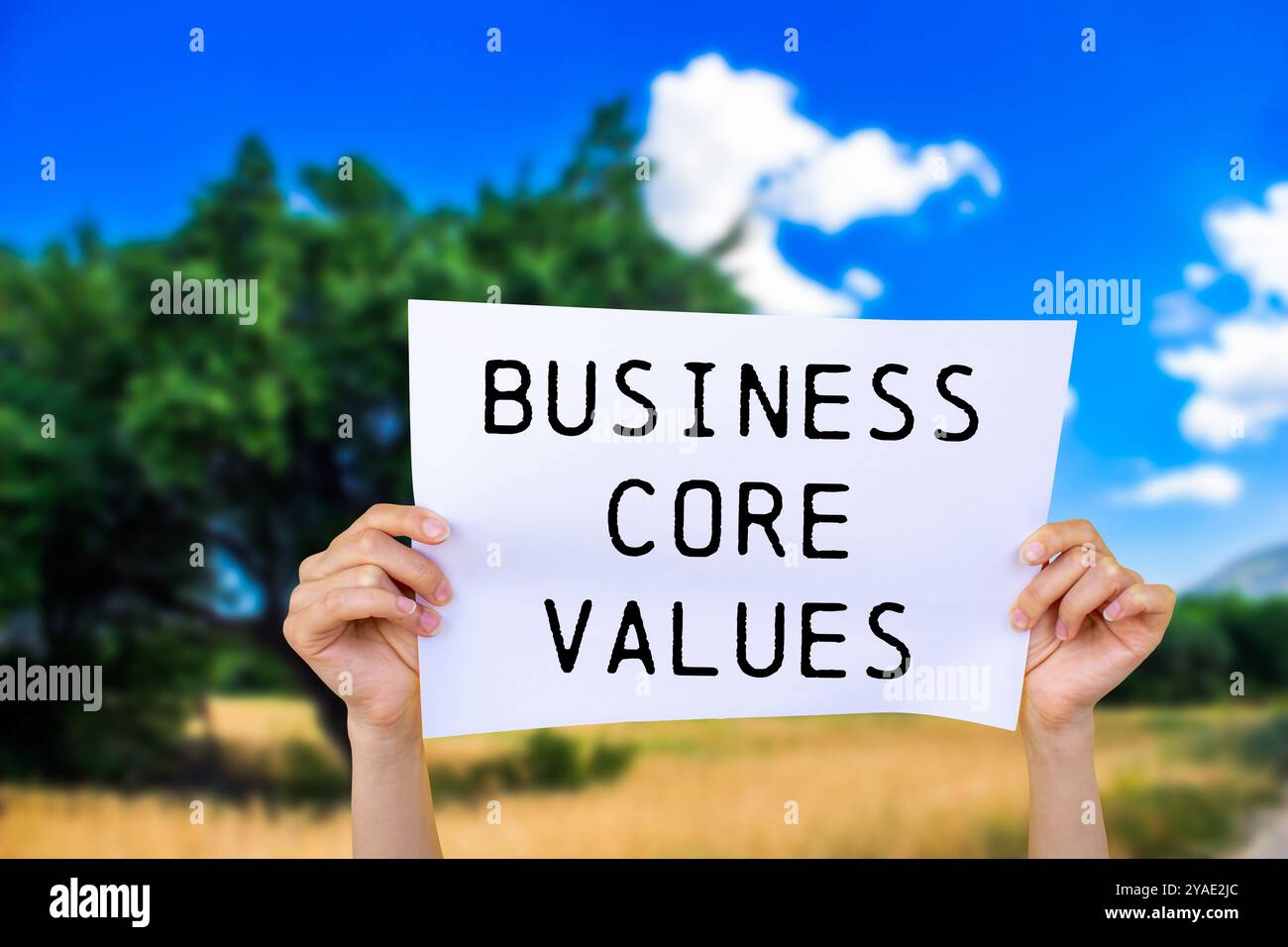 Business core values message written on white paper with nature background. Conceptual business ...