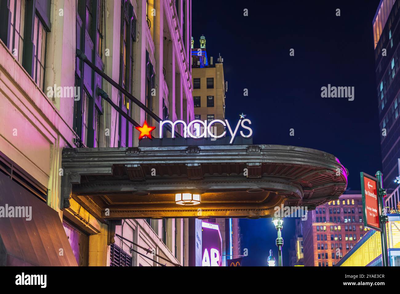 Illuminated Macy's sign on side of building at night in New York City ...