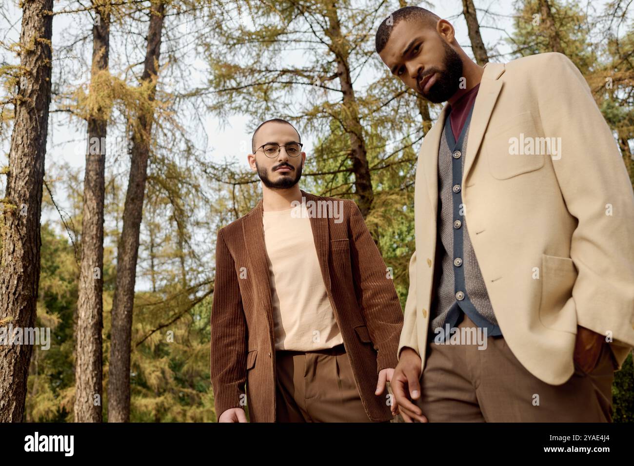 Handsome men showcase trendy autumn styles while enjoying a picturesque ...