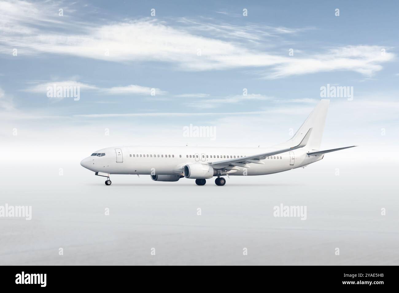 White passenger jet plane isolated on bright background with sky Stock ...