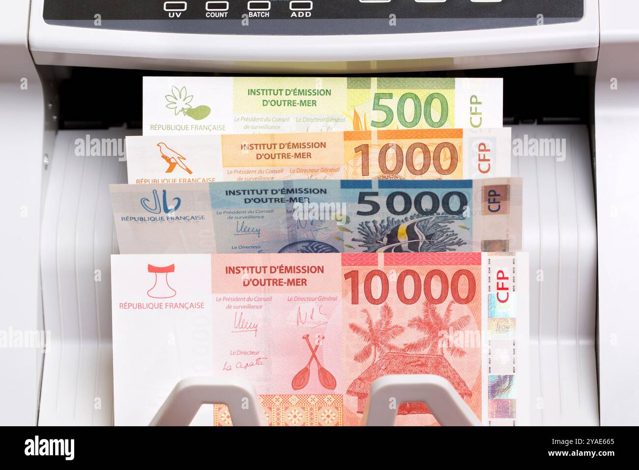 CFP money - franc in the counting machine Stock Photo - Alamy