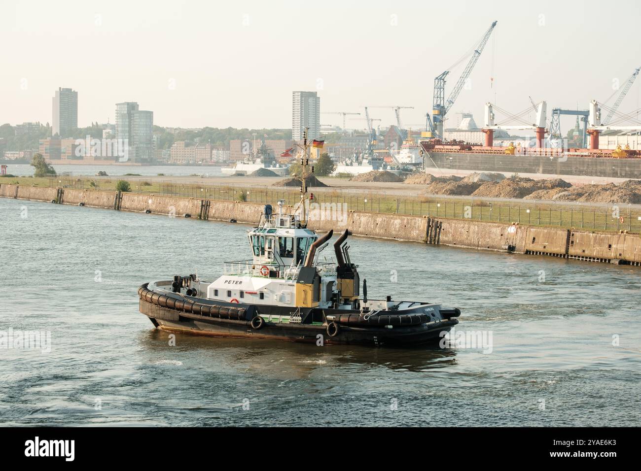 The harbour tug boat Peter supports the cruise ship in the port of ...