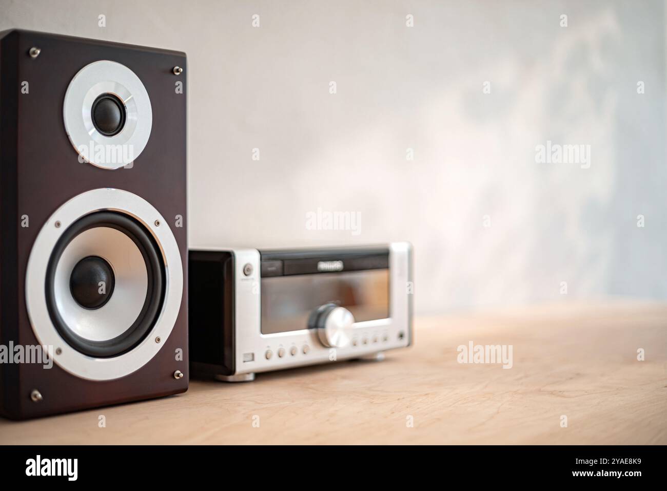 Stylish audio setup featuring a sleek speaker and modern stereo system ...