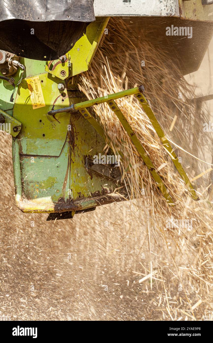 Combine riding through rural gathering hi-res stock photography and ...