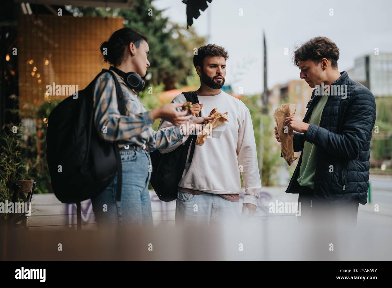 College students enjoying snacks during an outdoor break Stock Photo ...