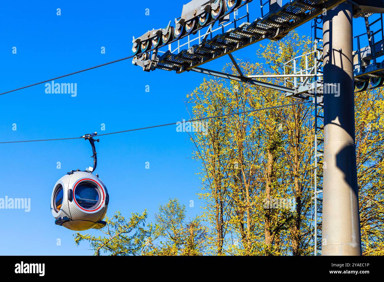 a cable car with round passenger cabins. aerial tram station. High ...