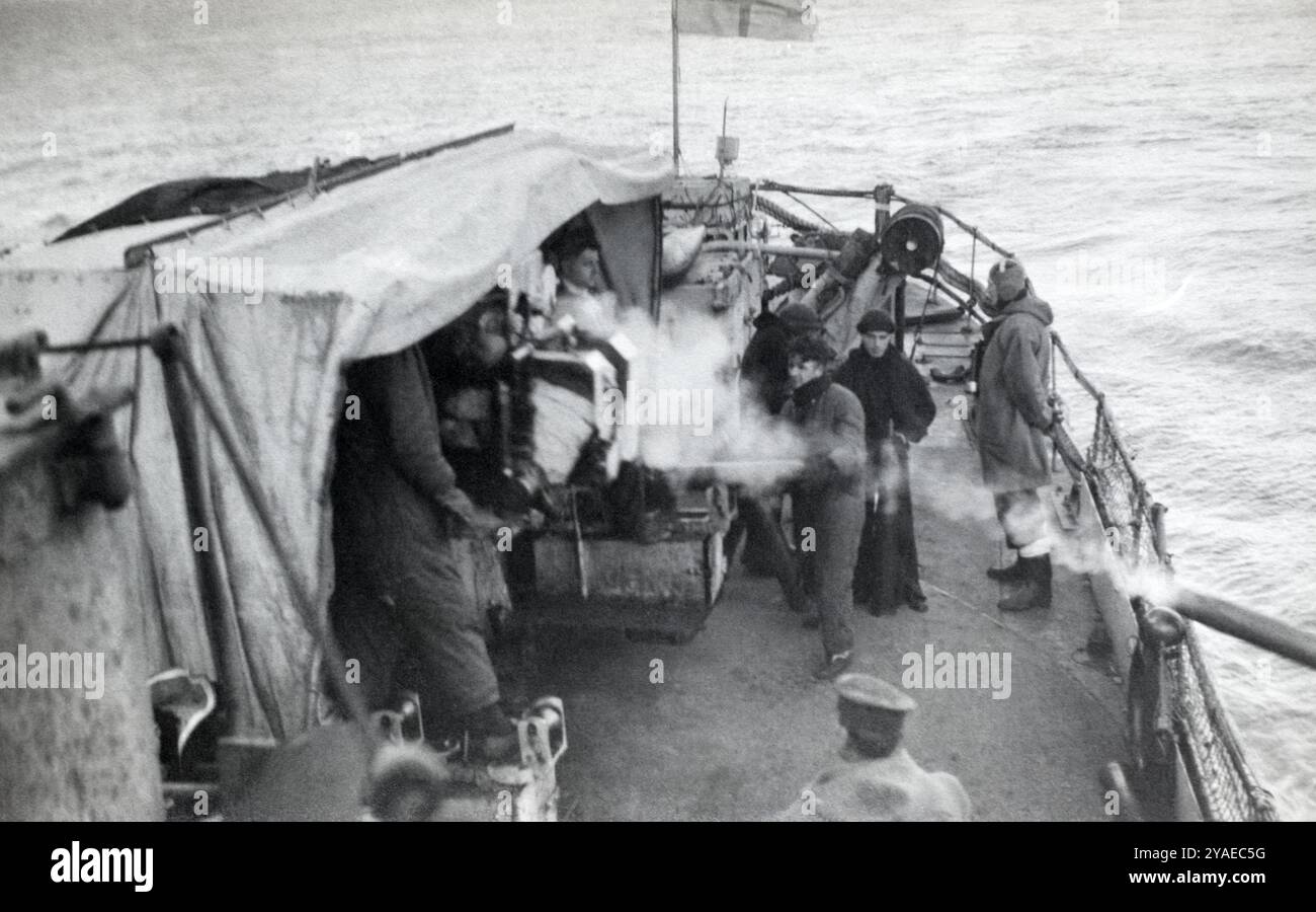 Royal Navy sailors firing 4-inch naval guns on the stern of a Hunt ...