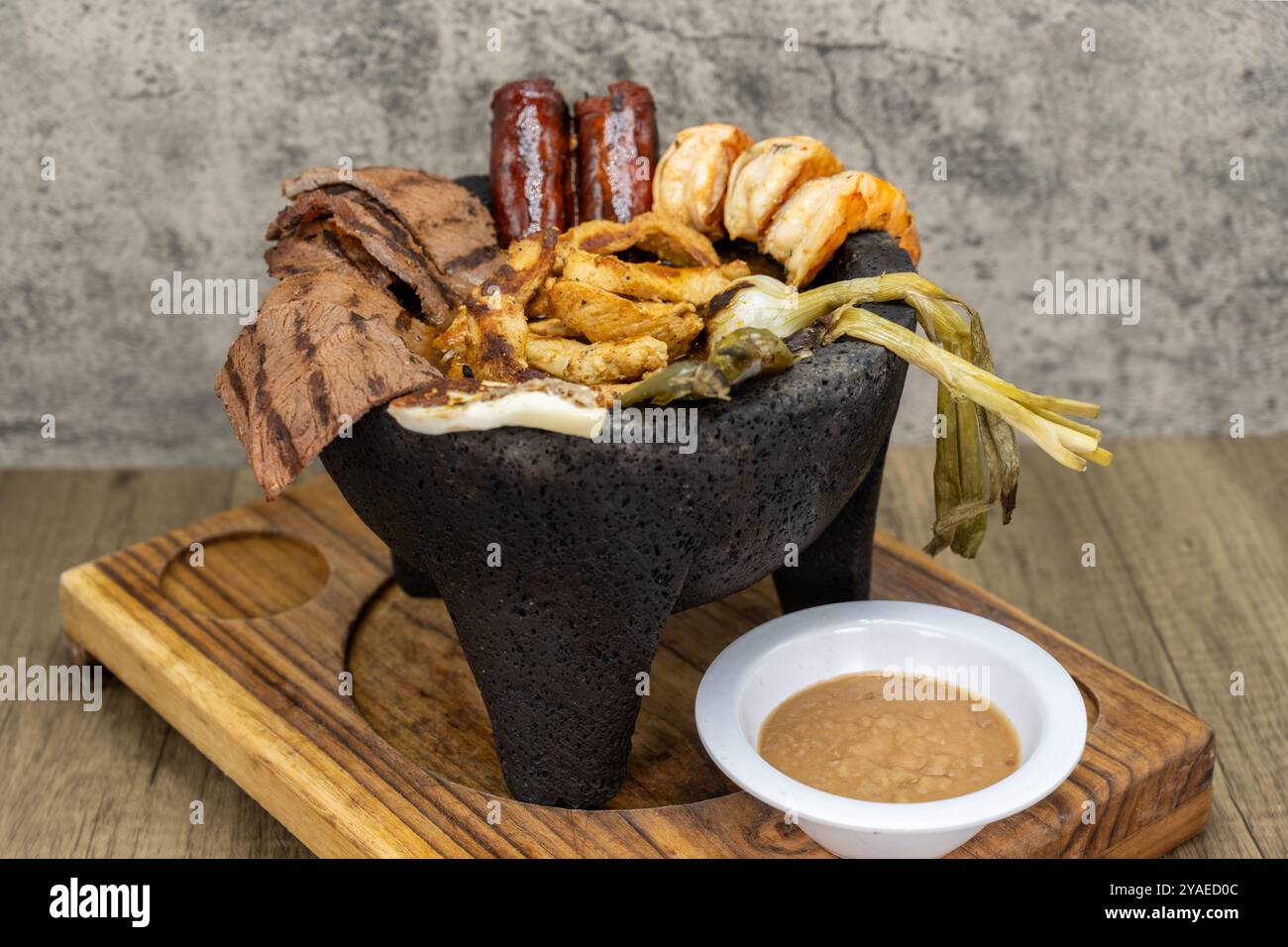 Mexican meat dinner molcajete filled with grilled carne asada, shrimp ...
