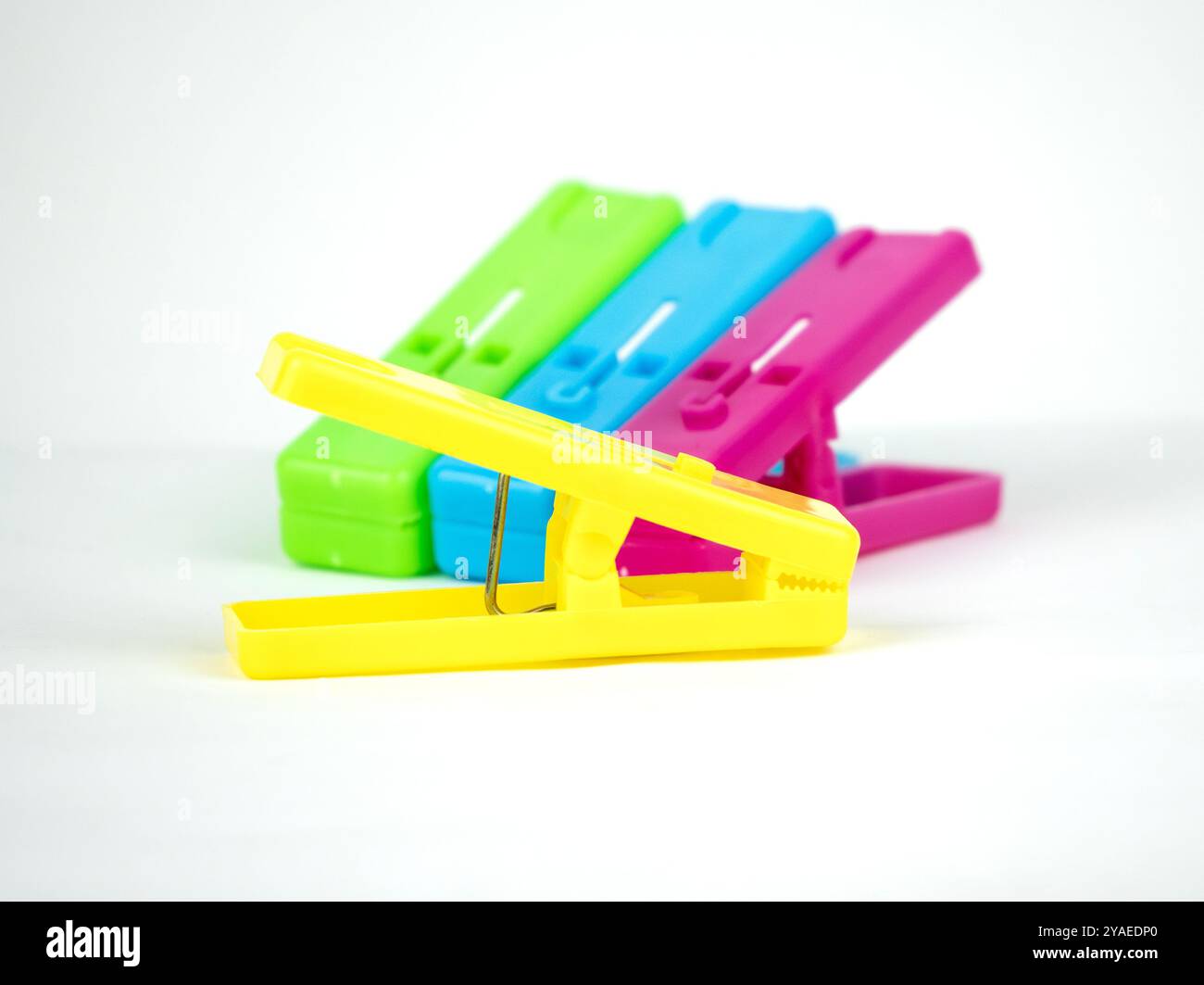 A collection of brightly colored clothespins is neatly arranged Stock ...