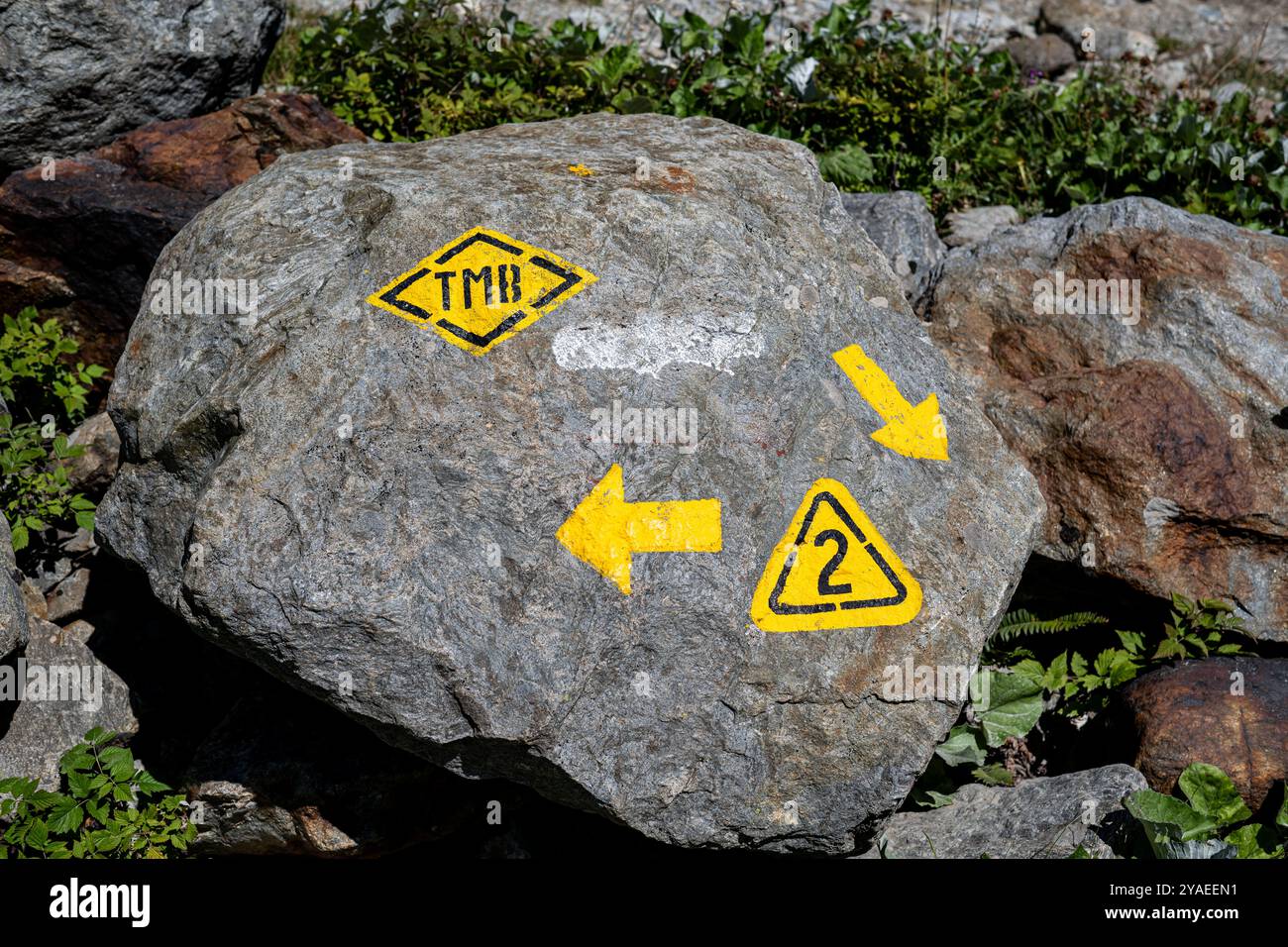 The Tour du Mont Blanc trail marker painted on a rock, Aosta Valley ...