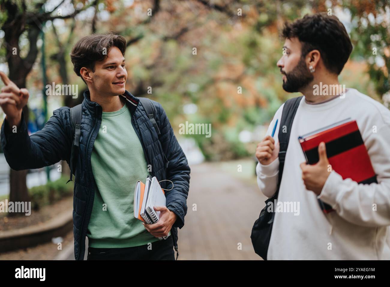 Group of college students discussing after exam outdoors Stock Photo ...
