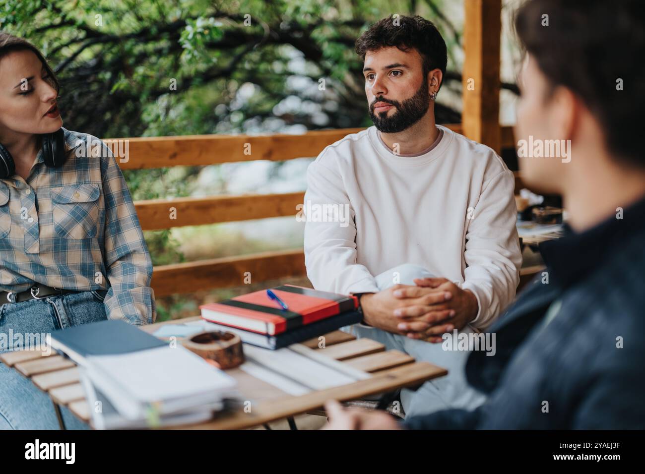 Group of students engaging in outdoor study session Stock Photo - Alamy