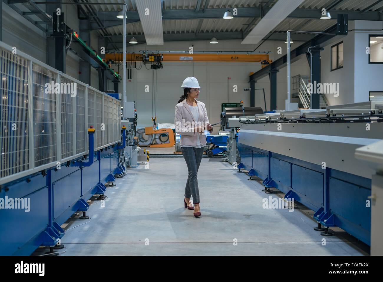 Indian woman a factory manager supervising the production process and ...
