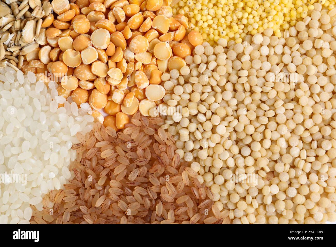 Different cereal grains as background, top view Stock Photo - Alamy