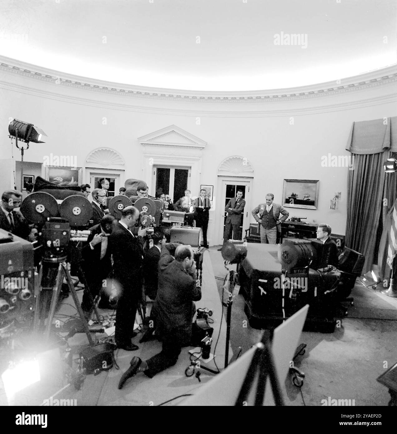 Cameramen film U.S. President John F. Kennedy delivering radio and ...