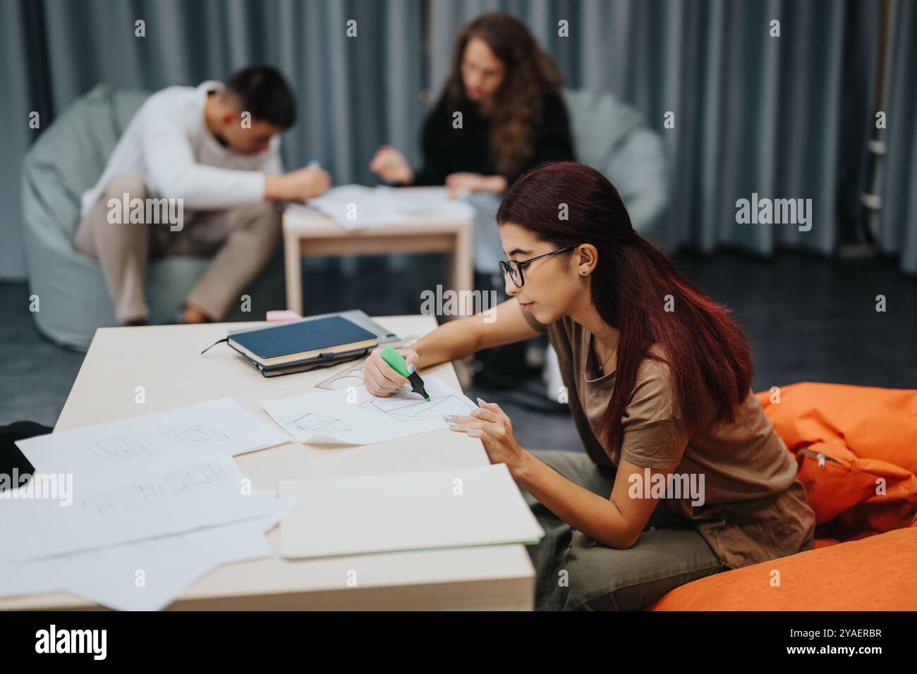 Students engaged in collaborative learning at school, focusing on ...