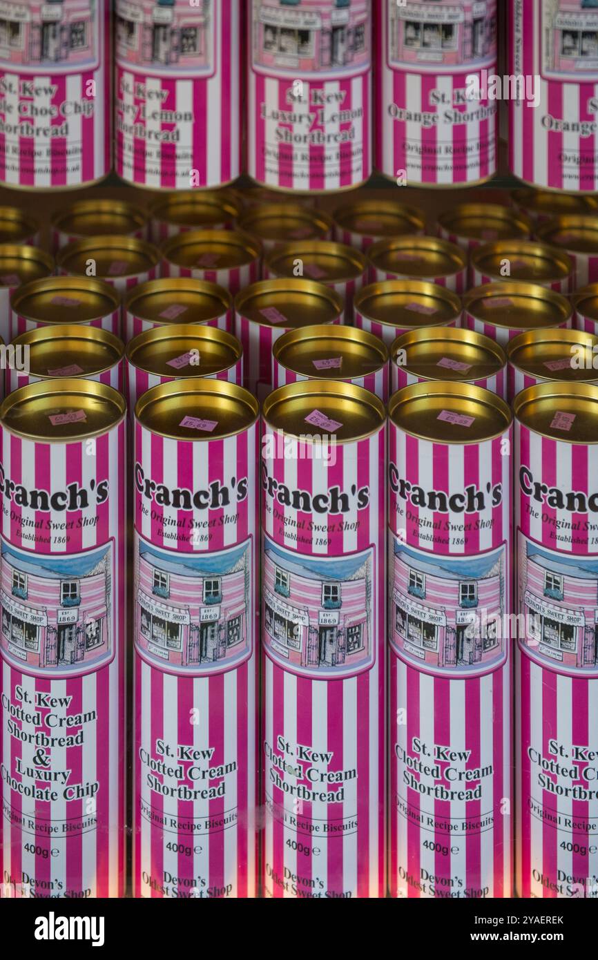 Rows of pink and white striped tins of Clotted Cream shortbread in the ...