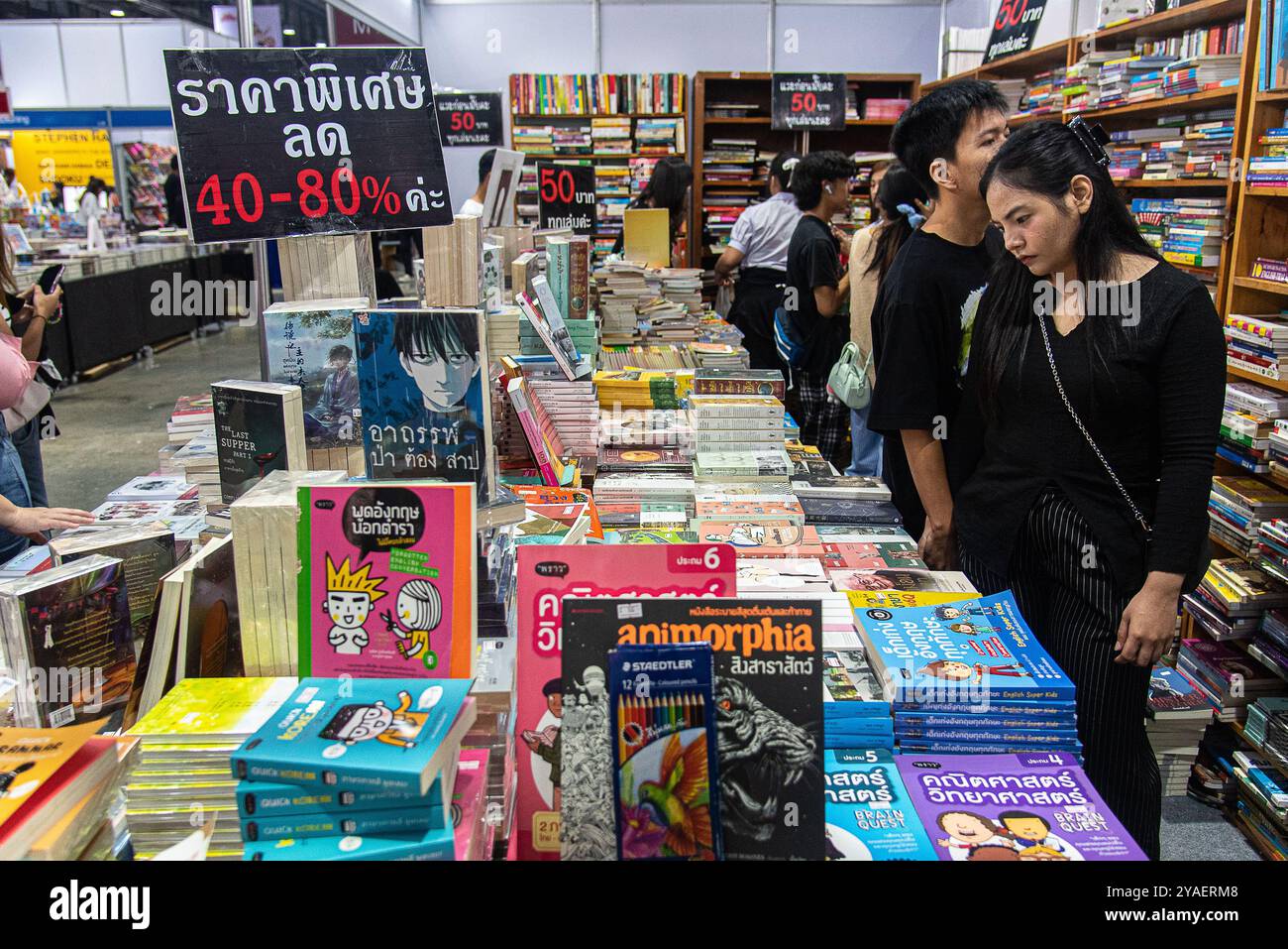 Visitors check books on display during the Book Expo Thailand 2024 at ...