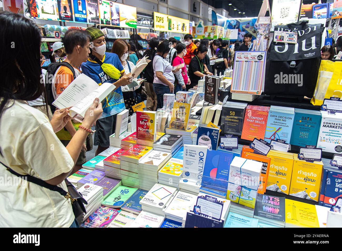 Visitors check books on display during the Book Expo Thailand 2024 at ...