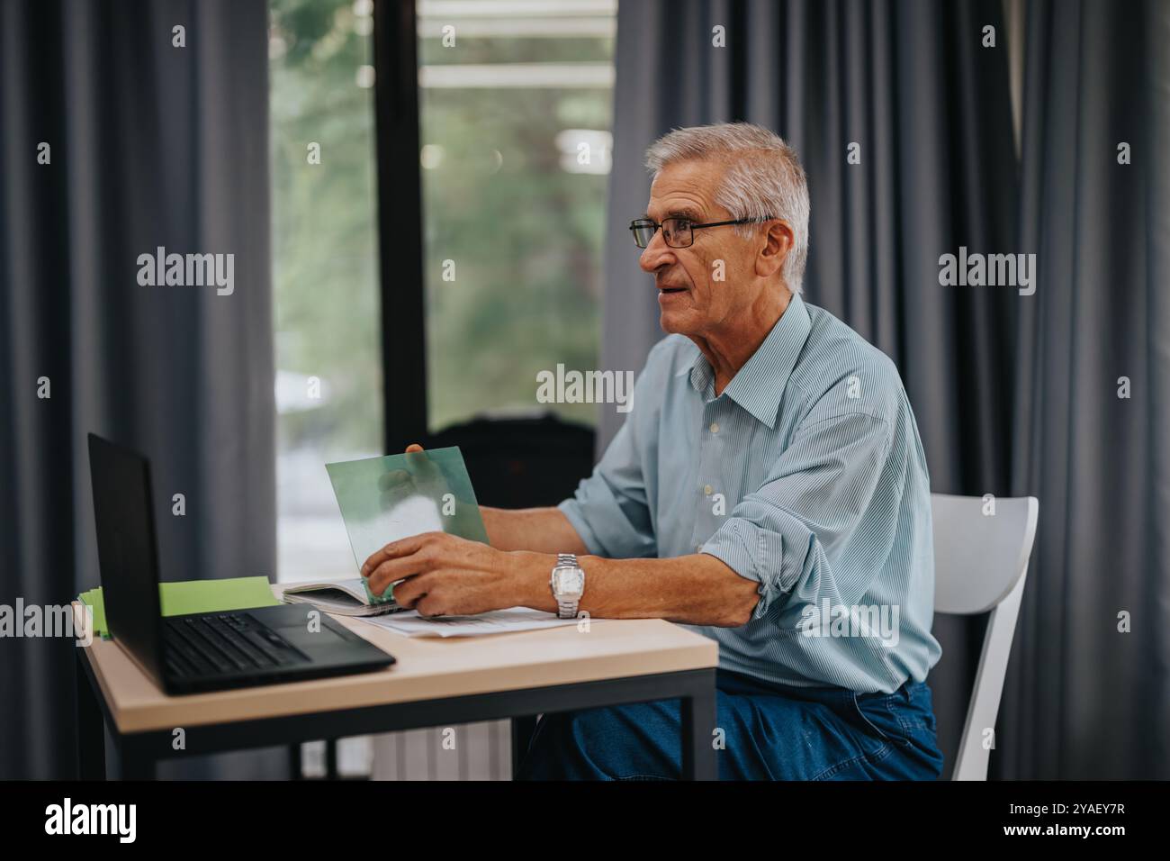 Elderly professor teaching students in a modern classroom setting Stock ...