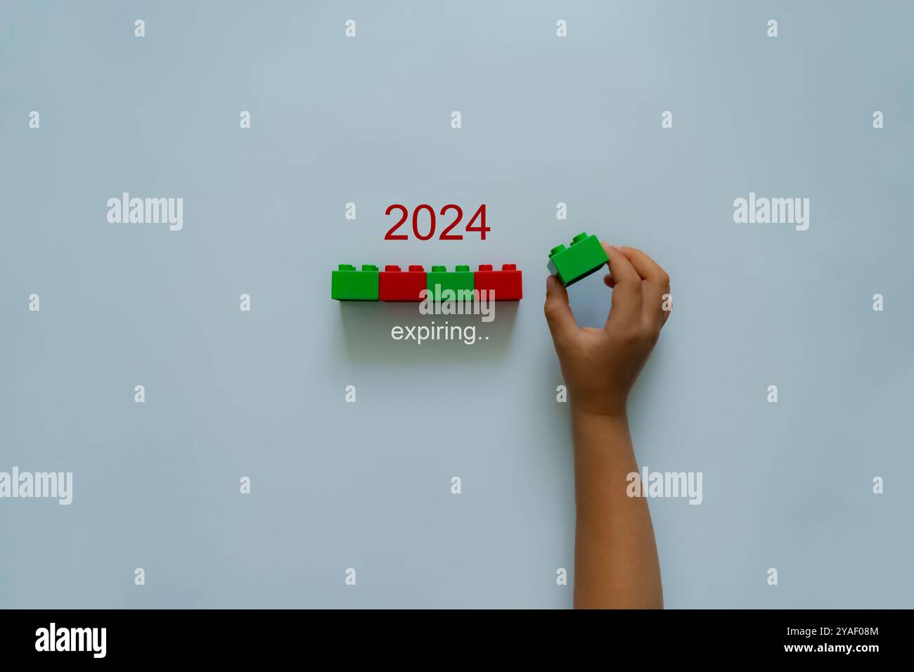 Loading new year 2024 to 2025 with child hand putting green plastic ...
