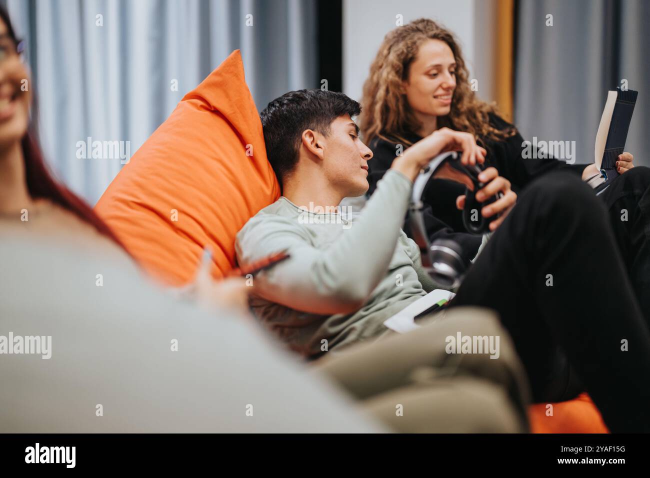 High school students relaxing and studying in a comfortable classroom ...