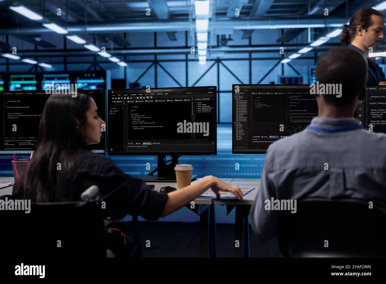 Person with paraplegia and colleague working in inclusive server farm ...