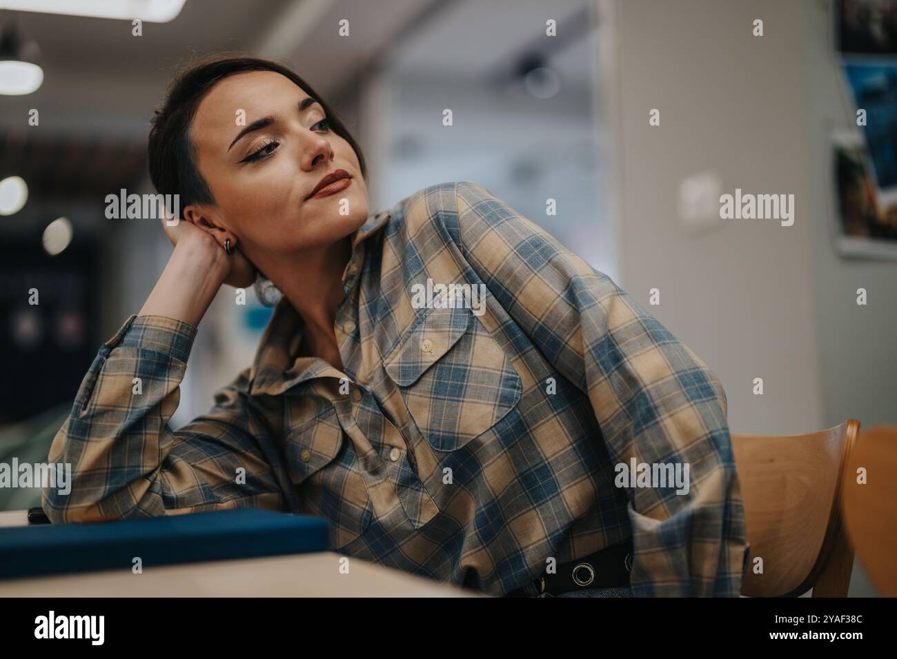 Student relaxing in a cozy classroom environment during study break ...