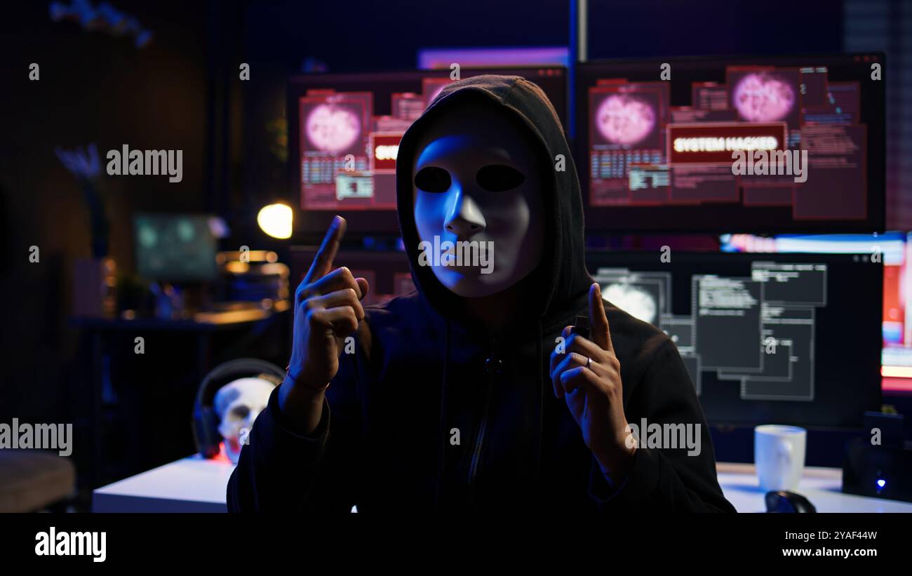 Hacker concealing identity filming hi-res stock photography and images ...