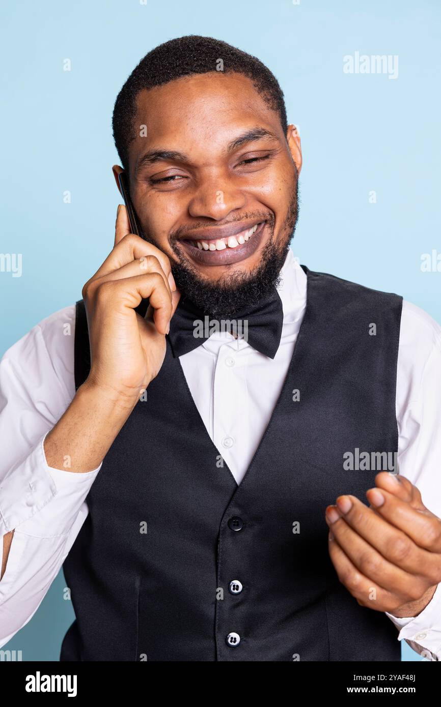 African american doorman gives information about hotel facilities on ...