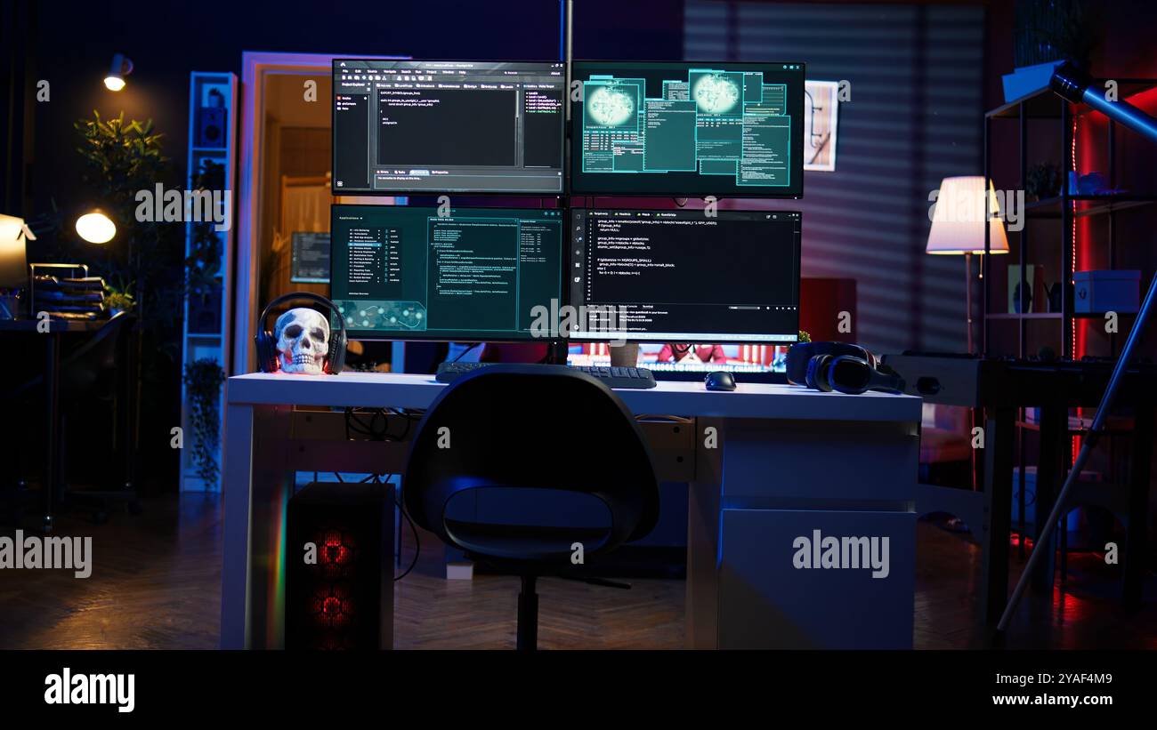 Lines of code running on computer monitors in empty room used by cybercriminal stealing ...